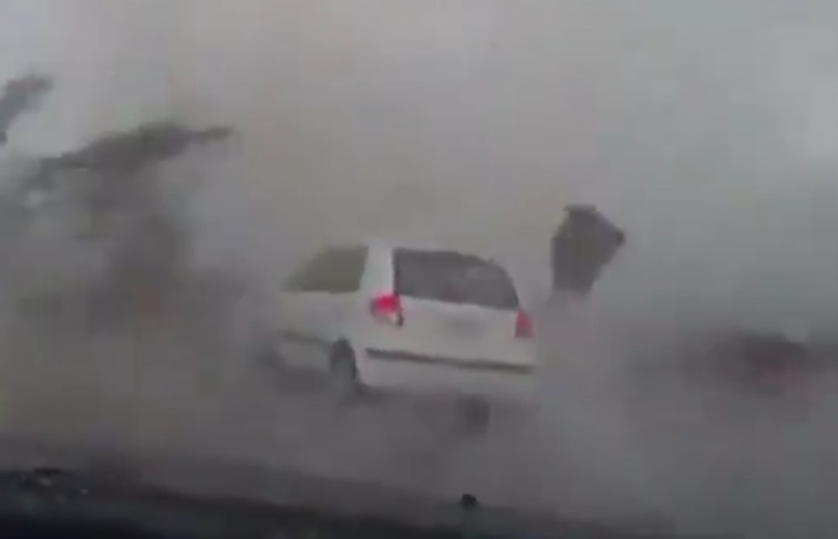 Amazing Power of a Tornado makes Car Disappear and Tosses its Occupant